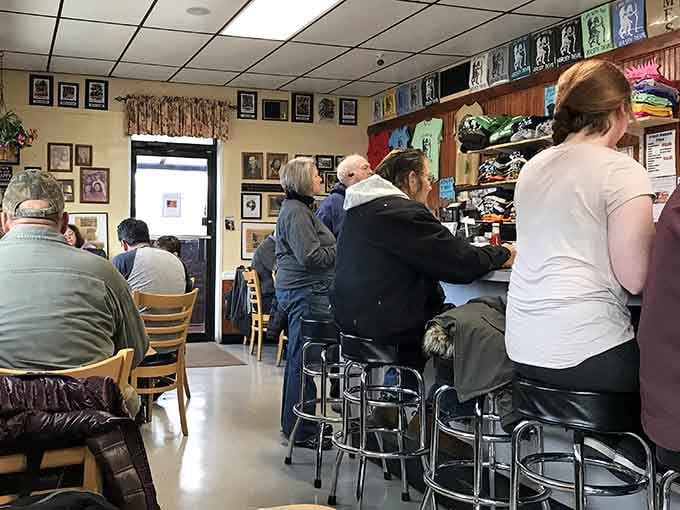 Regulars chatting over breakfast like old friends because great food brings communities together every single time.