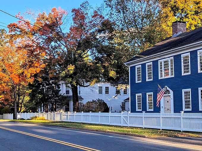 Fall foliage framing historic homes creates scenes so perfect they almost seem staged for maximum New England vibes.