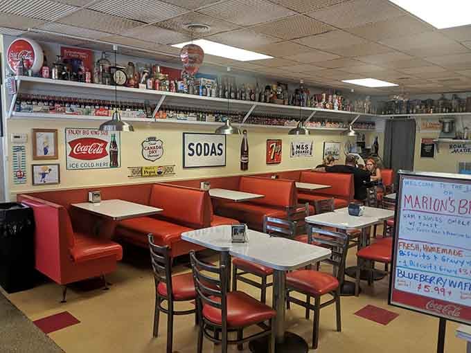 These red booths have hosted more family celebrations than a wedding chapel in Vegas, minus the Elvis.