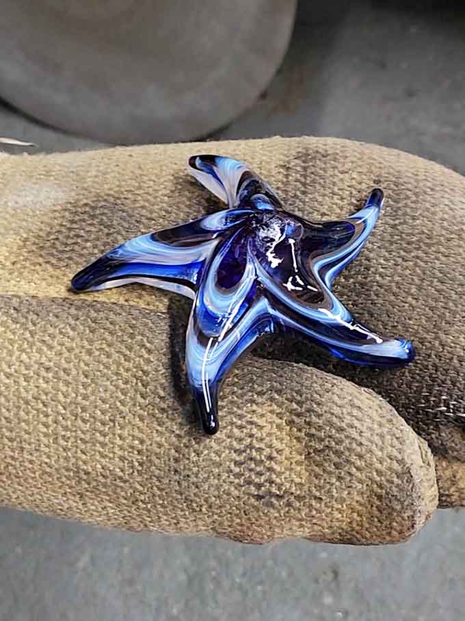 This handmade starfish captures the ocean's magic in swirling blues, perfect for any beach lover's collection.