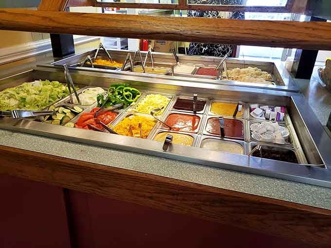 The salad bar offers fresh toppings for those maintaining the illusion of nutritional balance today.