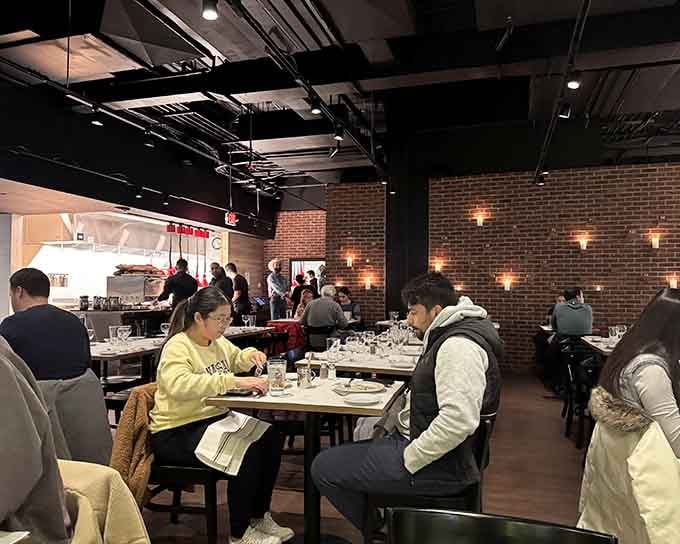 Happy diners enjoying their meals in a bustling space that proves simple concepts executed well never go out of style.
