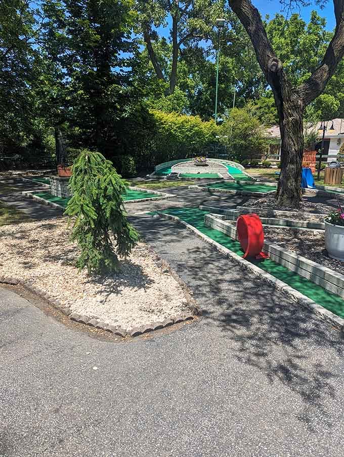 That miniature golf course winding through the shade proves even putting can be an adventure when you're three feet tall.
