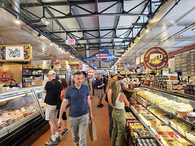 Happy shoppers navigate aisles of deliciousness, their faces showing the universal expression of "I'm buying everything here today."