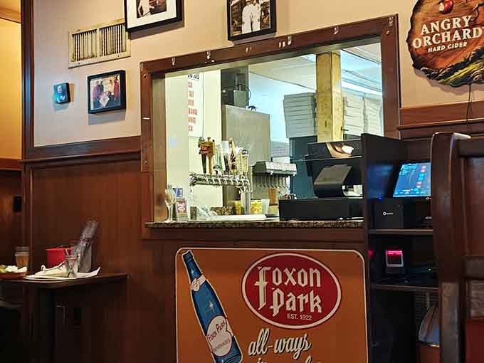 Through that window, pizza magic happens while you wait, anticipation building with every passing delicious moment of patience.