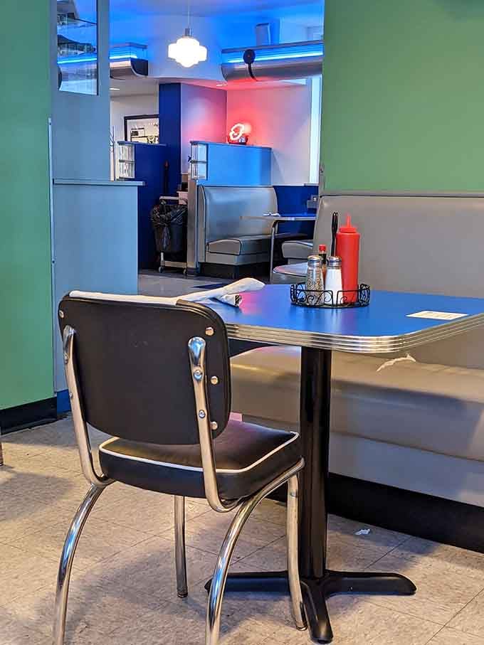 Colorful walls and chrome-edged tables create a cheerful atmosphere that makes every meal feel like a celebration.