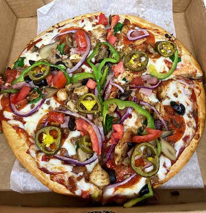 Pizza loaded with every topping imaginable shows this place refuses to do anything halfway or boring.