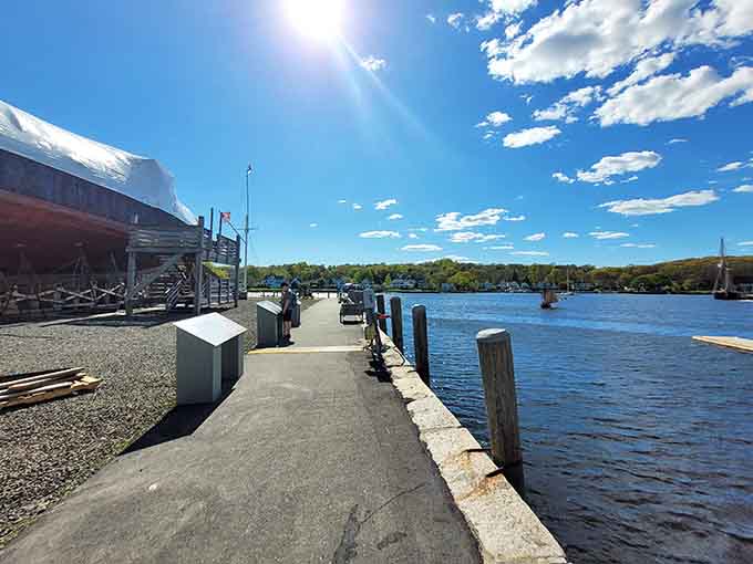 The waterfront walkway offers peaceful views that contrast sharply with the dangerous voyages these ships once made.