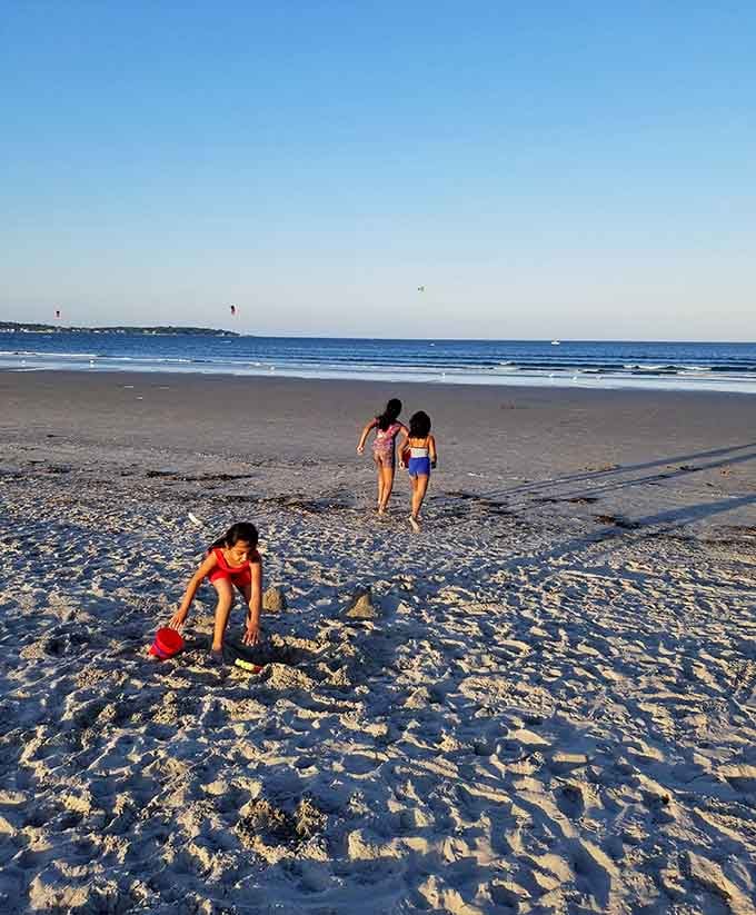Building sandcastles at golden hour, creating memories that'll outlast any structure they're constructing right now.