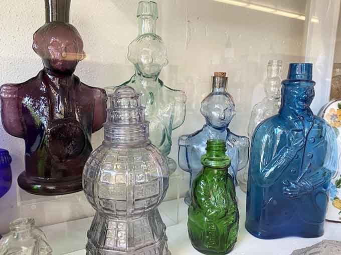 Figural bottles shaped like people and objects add whimsy to the collection, proving glassmakers had imagination.