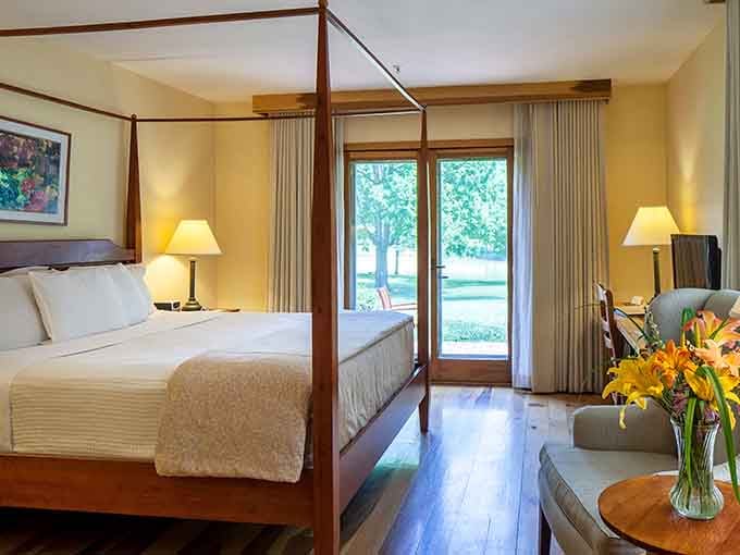 Four-poster beds and garden views create the perfect retreat after a day exploring New Harmony's unexpected cultural treasures.