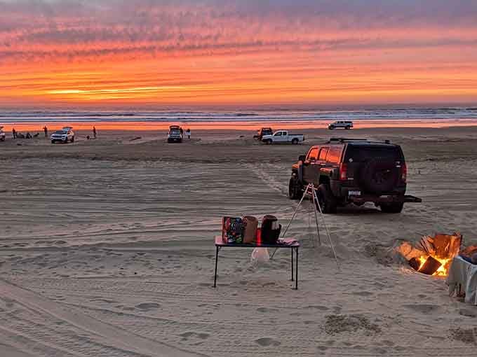 Sunset camping with a campfire, folding chairs, and an ocean view beats any hotel room.