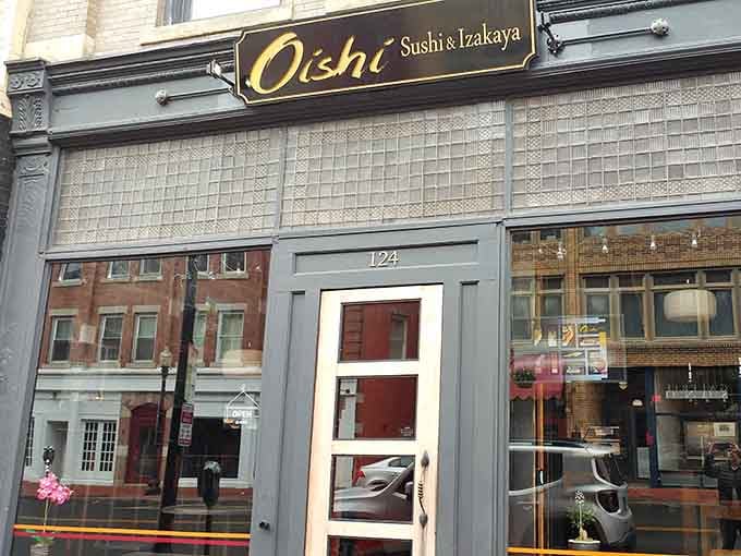 The sleek storefront at 124 blends seamlessly into downtown Norwalk while that golden sign ensures you won't miss your destination.