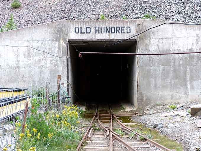 The concrete portal entrance looks unassuming until you realize you're about to ride into an actual mountain.