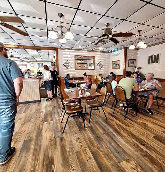 Real diners enjoying real meals in a real restaurant, no phones out, no performances, just eating and talking.
