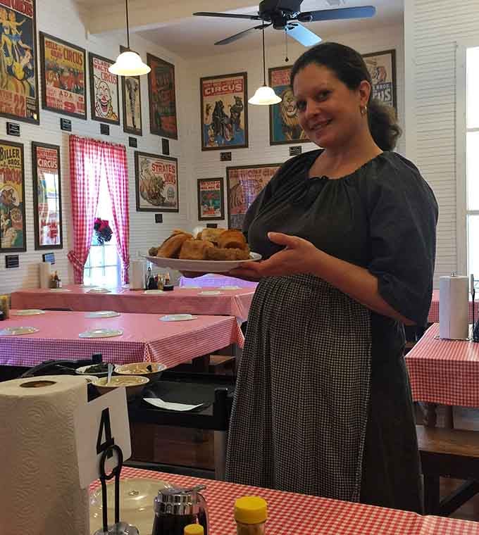 Friendly staff bringing platters of hot chicken to your table like they're delivering edible happiness, which they are.