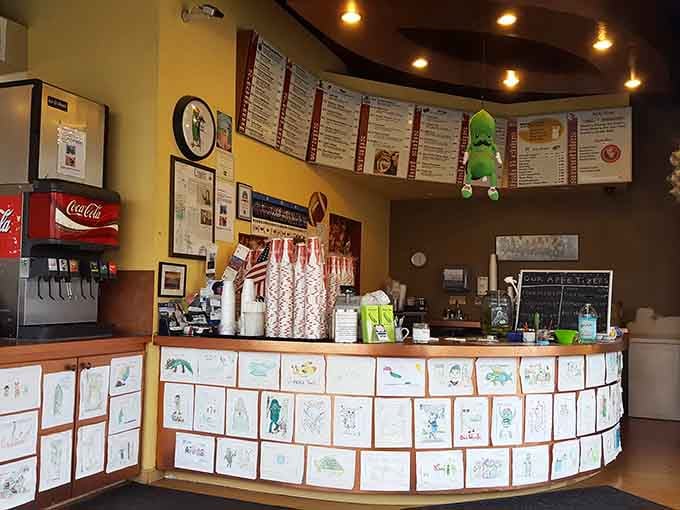 Behind this counter, magic happens, where burgers meet pickles and everyone leaves happy and slightly bewildered.