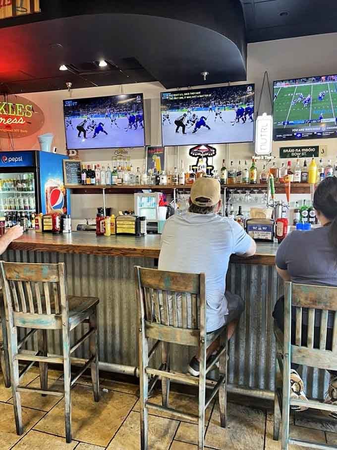 The bar area serves up cold drinks and good times with multiple screens for sports enthusiasts.