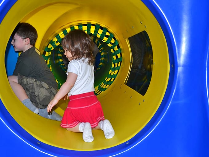 Kids crawling through tunnels like they're discovering Atlantis, completely oblivious to the outside world and its responsibilities.
