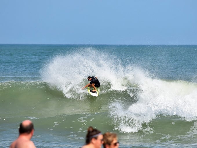 Surfers catch waves that have traveled across the entire Atlantic just to break right here perfectly.