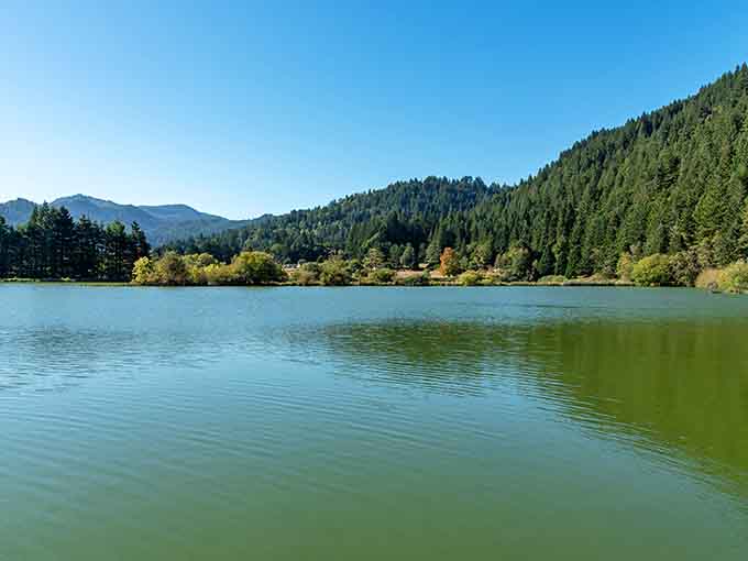 The peaceful pond reflects surrounding peaks, offering fishing and tranquility in equal measure to those who make the journey.