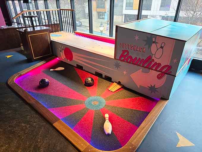Mini bowling meets mini golf in a collision of miniature sports that somehow works beautifully together here.