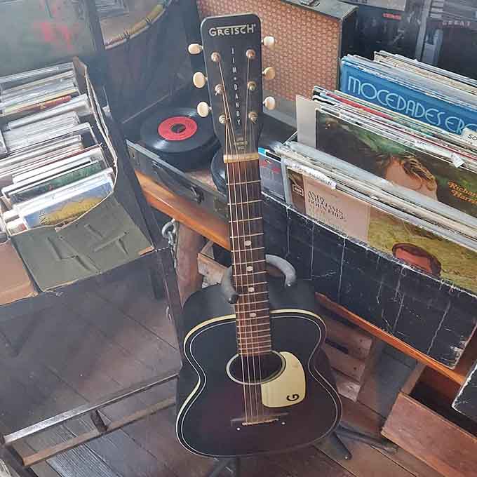 Guitars and vinyl records remind us that the best music never needed electricity or algorithms to touch souls.