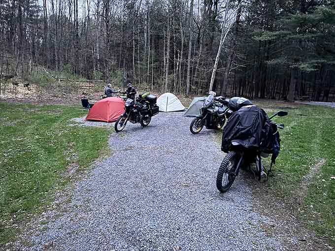 Motorcycles parked beside tents prove adventure comes in many forms, all welcome at this democratic slice of Pennsylvania paradise.