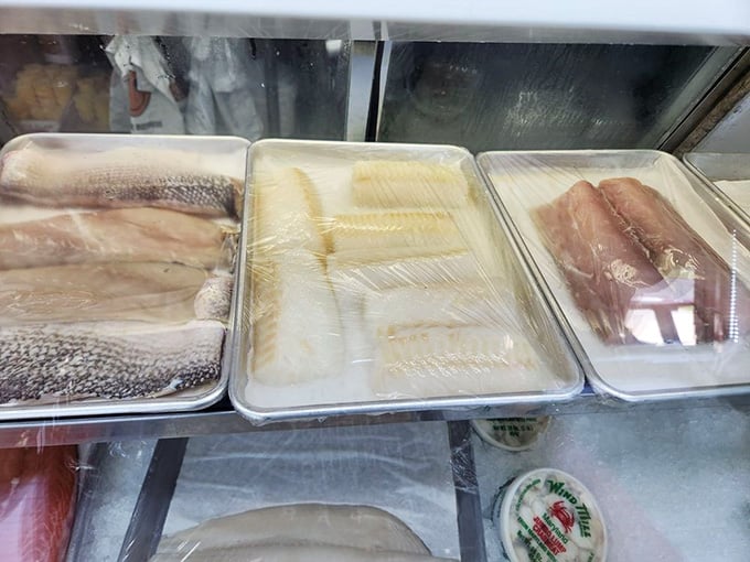 Fresh fillets lined up in pristine display cases, waiting to become someone's dinner like actors ready for their curtain call.