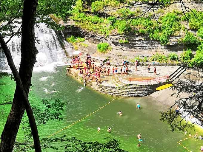 The main swimming hole fills with happy visitors enjoying nature's original infinity pool design concept.