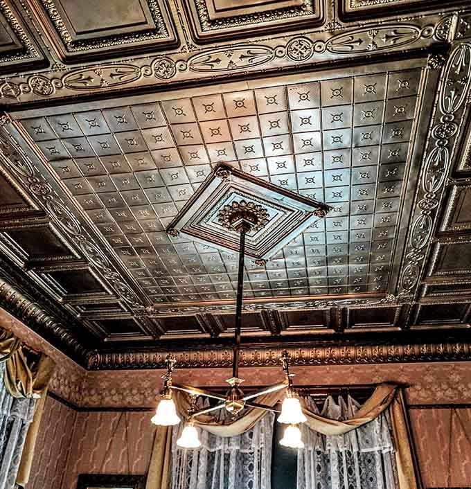 Look up and marvel at the pressed metal ceiling, a stunning example of craftsmanship that modern construction rarely matches.