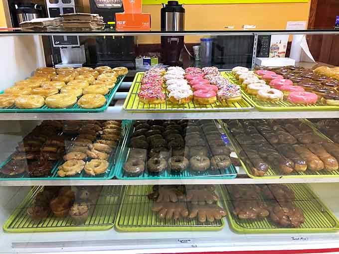 Display cases packed with donuts in every flavor imaginable, making choosing just one flavor nearly impossible.