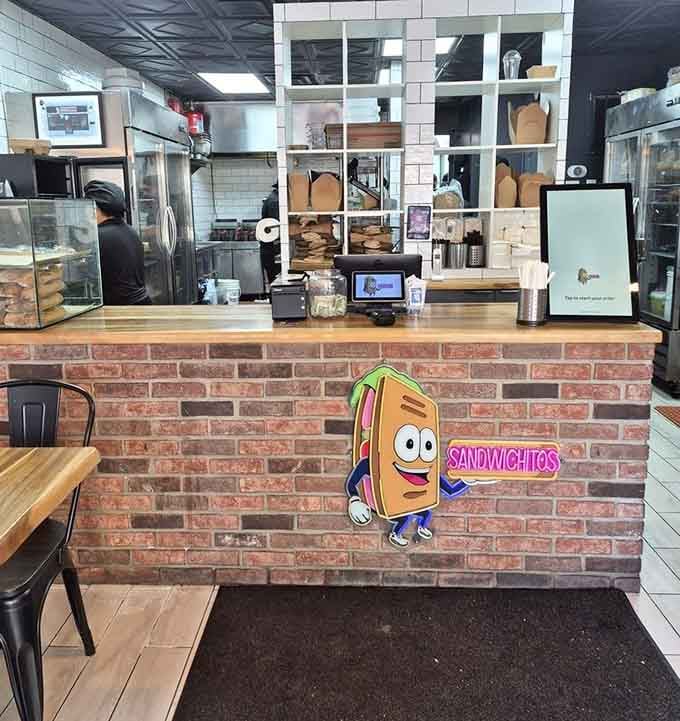 Behind this cheerful counter, sandwich magic happens daily, transforming simple ingredients into handheld masterpieces worth celebrating.