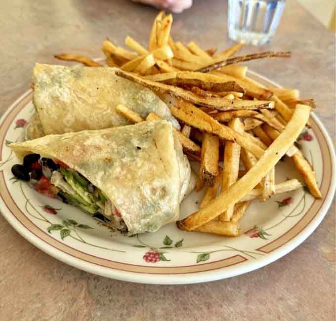This black bean wrap with a mountain of crispy fries proves that lunch here rivals breakfast's legendary status.