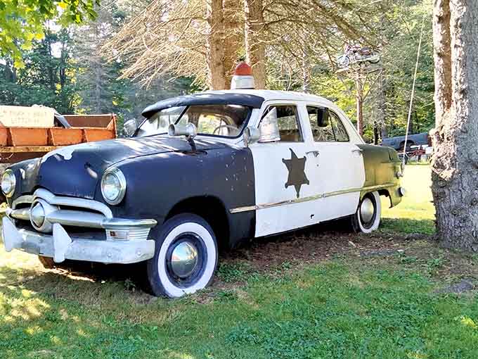 This vintage patrol car has officially retired from duty but still keeps watch over the park.