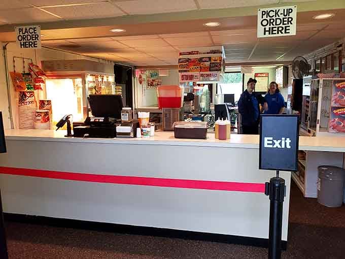 The snack bar counter beckons with promises of buttery popcorn and ice-cold drinks to complete your experience.