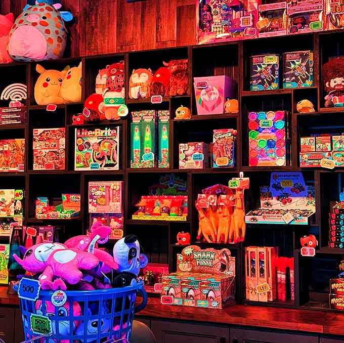 The prize wall bursts with colorful toys and nostalgic treasures, tempting kids and adults alike to try their arcade luck.