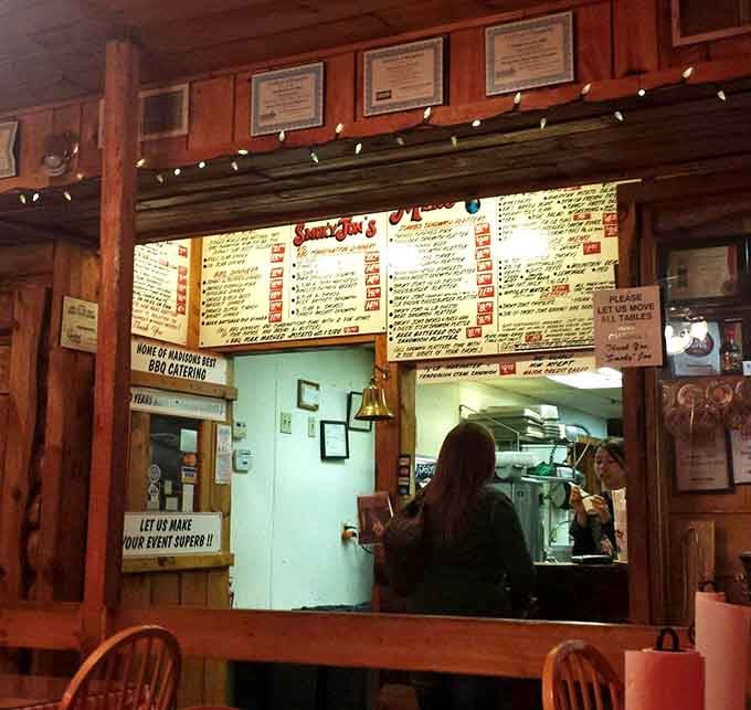 The order counter beckons with handwritten menu boards that promise authentic smoked meats prepared with care and expertise.