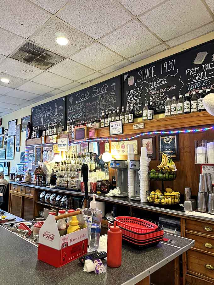 The counter displays fresh bananas and organized chaos, where magic happens between orders and friendly conversation.