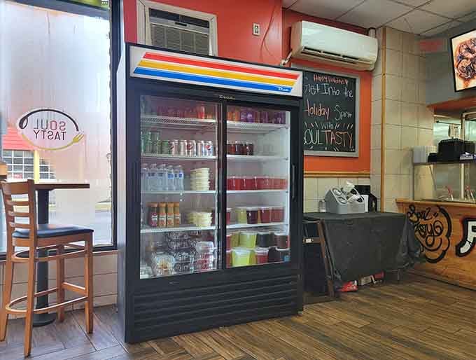 A beverage cooler stocked with drinks to complement your meal, because even soul food needs proper liquid accompaniment always.