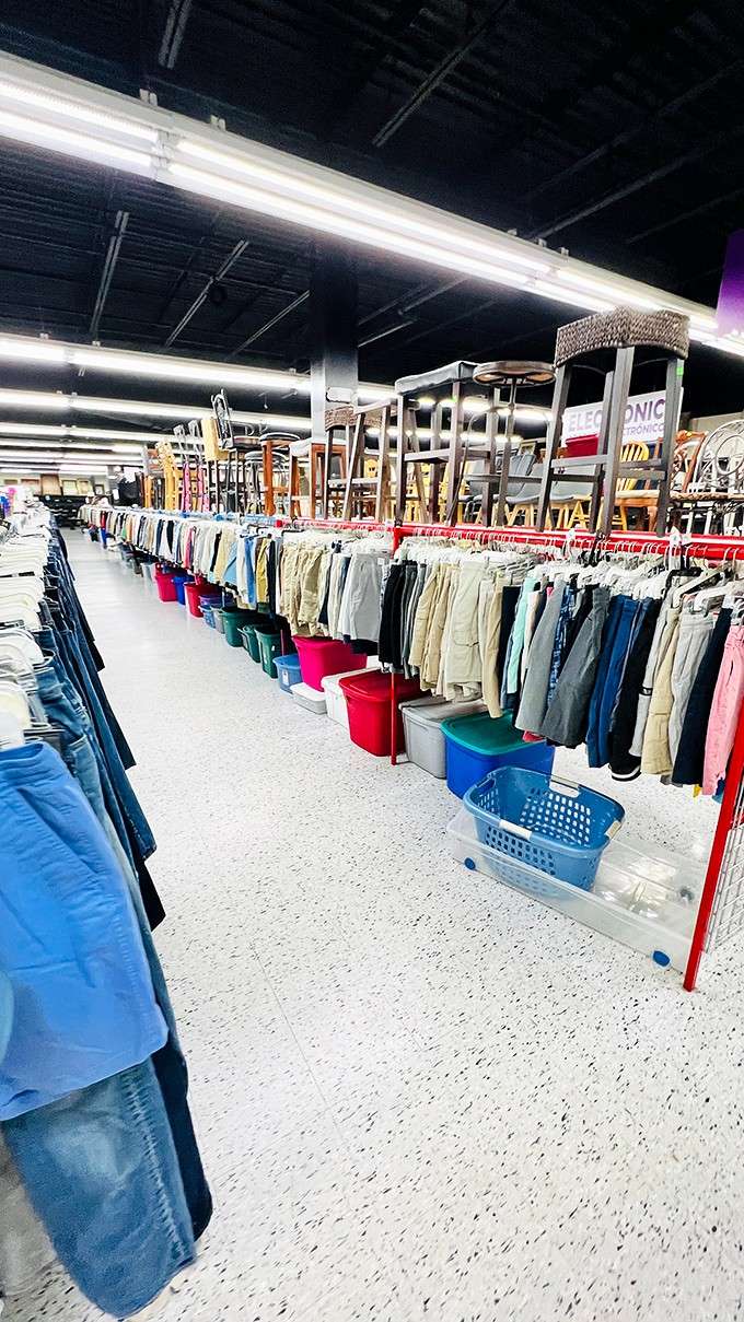 Furniture stacked overhead while clothes hang below, maximizing every inch of this treasure-hunting paradise with impressive efficiency.