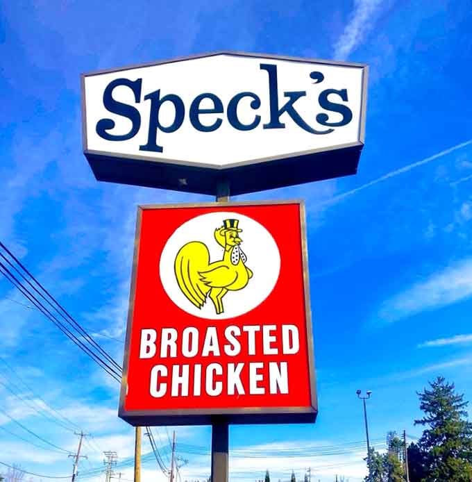 That cheerful chicken logo has been guiding hungry travelers to crispy salvation for longer than most restaurants survive.