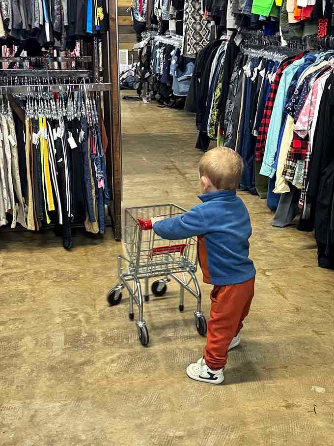Young bargain hunters learn early that smart shopping beats impulse buying, one adorable cart push at a time here.