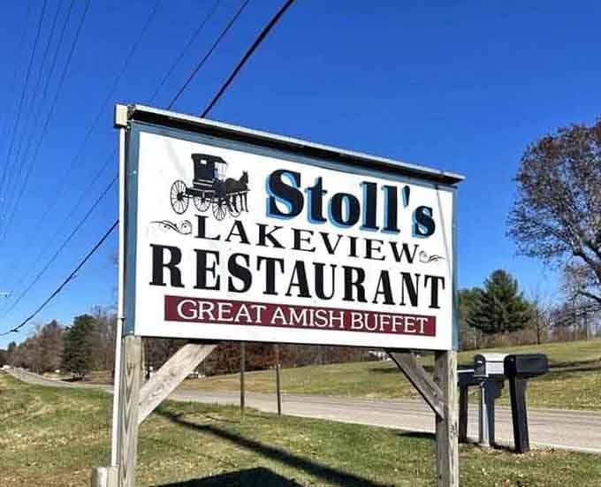 The roadside sign announces your destination with old-school charm and the promise of that legendary Amish buffet experience.