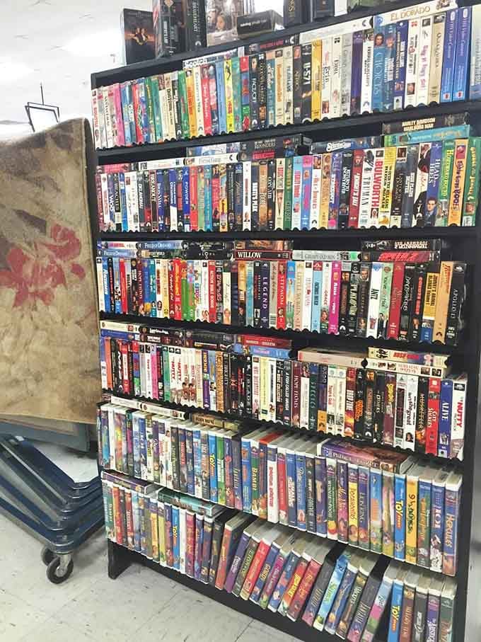 VHS tapes stand proudly, defying streaming services and reminding us when rewinding was actually a thing we did.