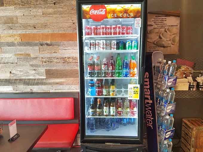A proper beverage cooler stocked with everything from Coca-Cola to authentic Polish sodas for adventurous sippers.