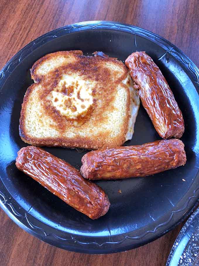 Egg-in-a-hole with sausage links proves breakfast here is just as serious as lunch&mdash;simple, satisfying, and cooked to perfection.