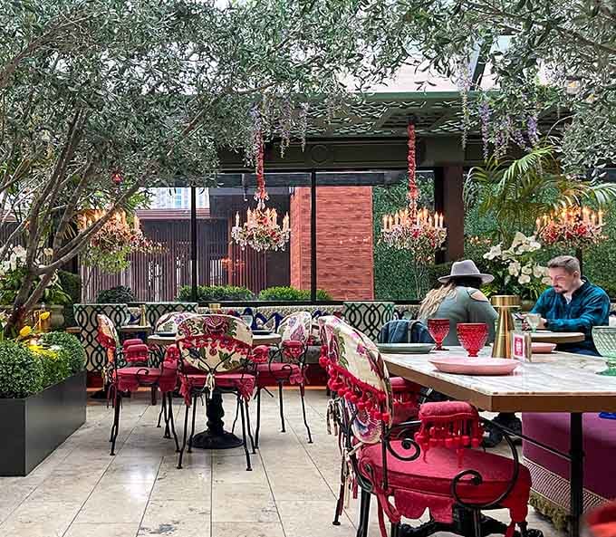 Diners enjoying their meal surrounded by nature, proving that good company and great food never go out of style.