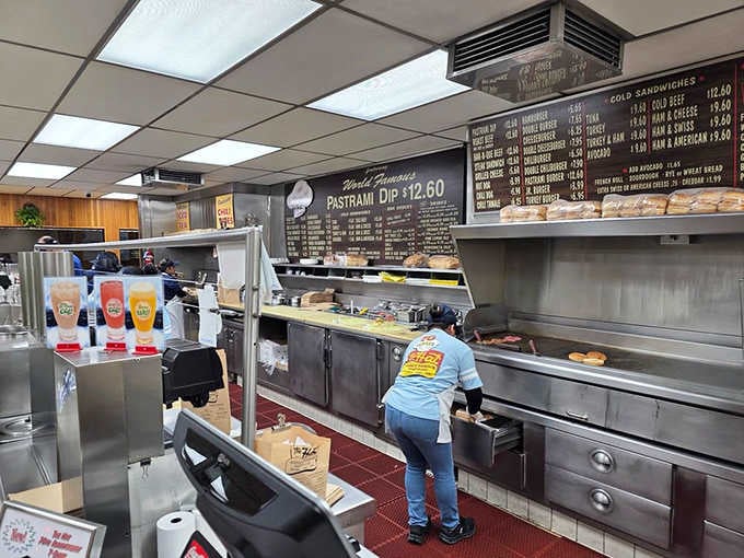 The cooking area hums with activity, where pastrami dreams become delicious reality one order at a time.