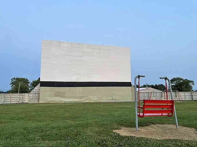 That pristine white screen waiting for darkness, like a blank canvas ready for Hollywood's finest work.